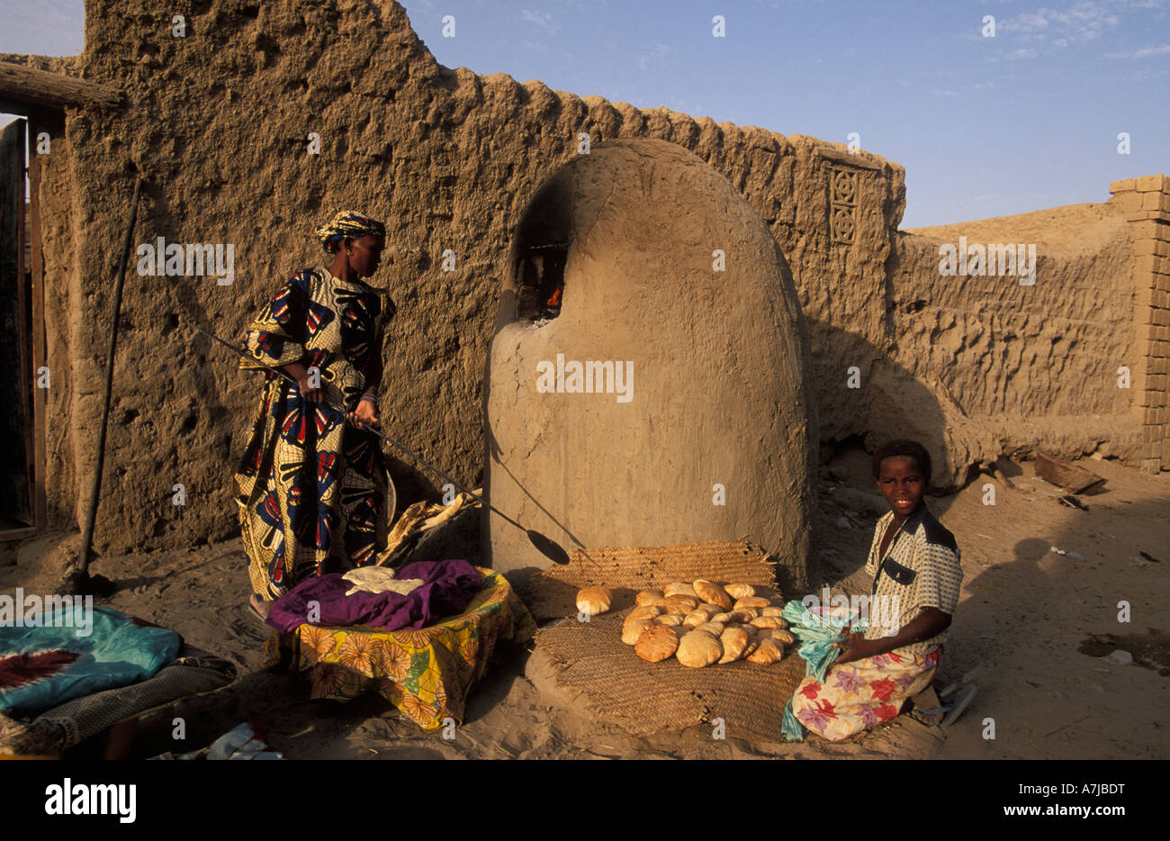Traditional work in a tribal village of africa hi-res stock photography ...