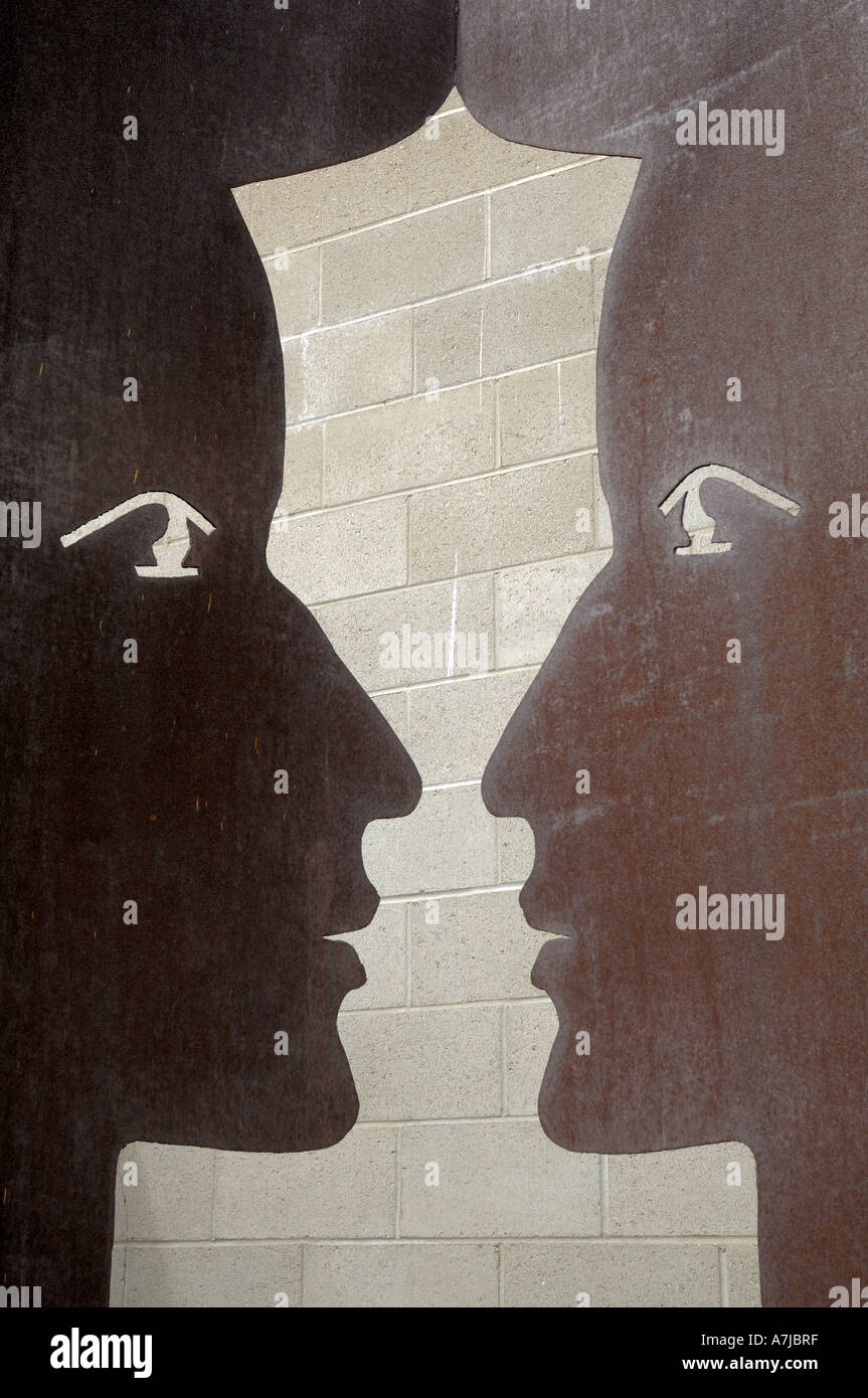 Human face figures created with metal sheets facing each other Stock ...