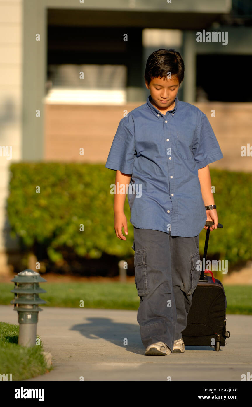 Child rolling backpack school hi-res stock photography and images - Alamy