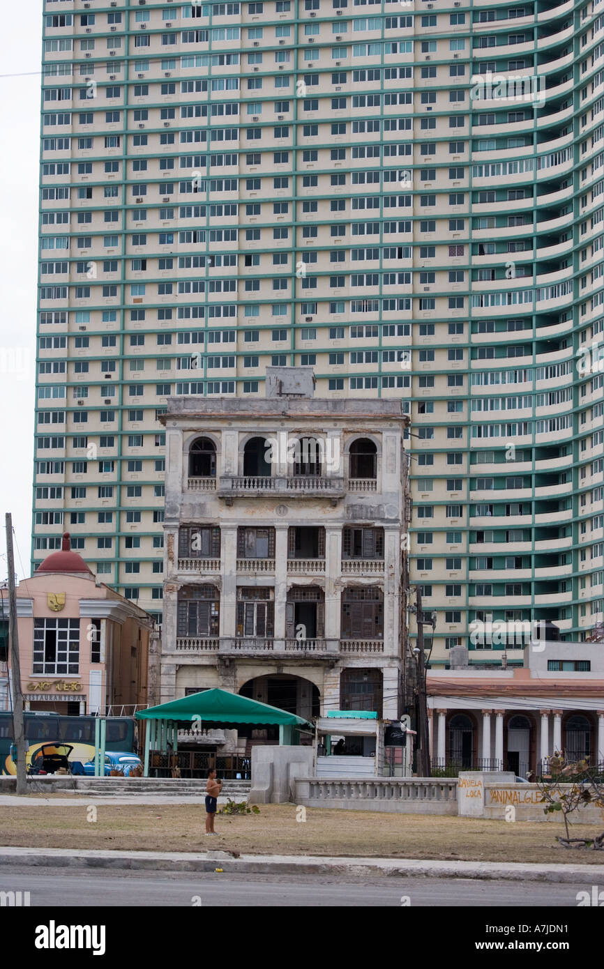 Cuban colonial buildings in Havana's Vedado district are dwarfed by the ...