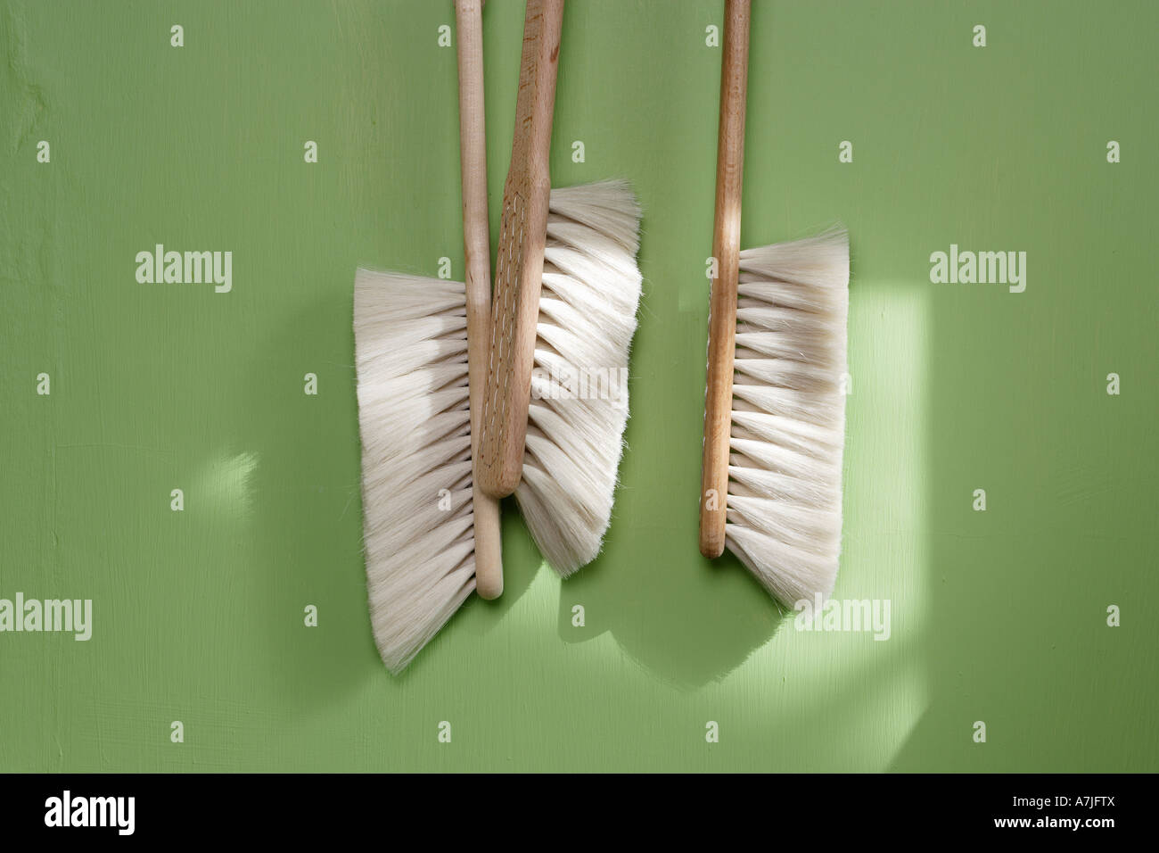 Dusting brushes hanging Stock Photo - Alamy