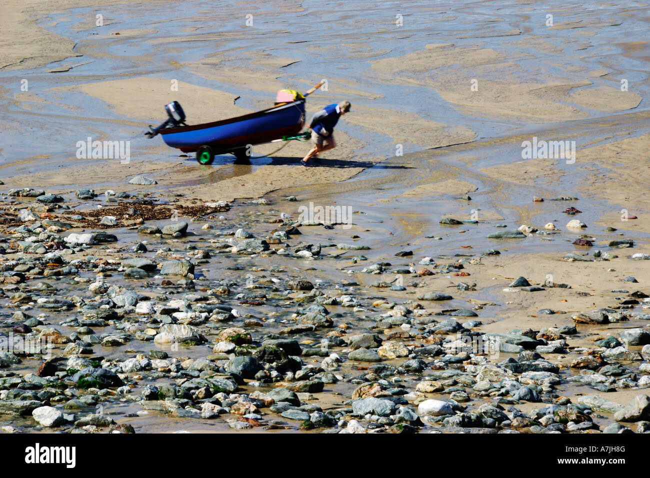 Man pulling boat out water hi-res stock photography and images - Alamy
