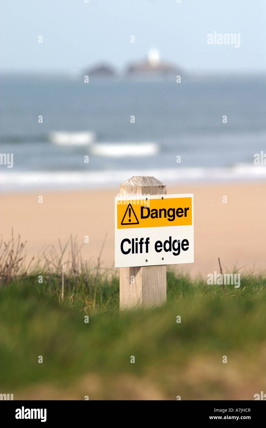 Danger Cliff Edge sign overlooking Godrevy Lighthouse West Cornwall UK ...