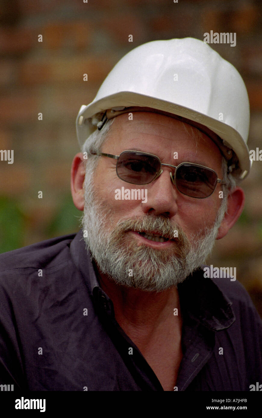 worker with beard and helmet on the head Stock Photo - Alamy