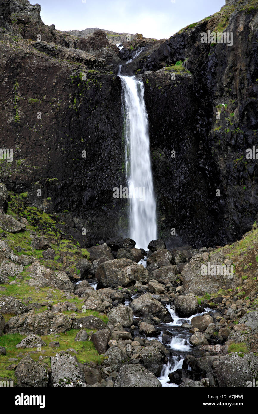 Waterfall tumbling down onto rocks in Iceland Stock Photo - Alamy