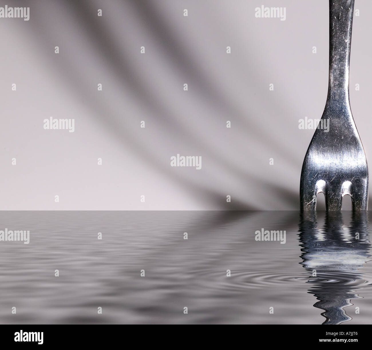 fork in water Stock Photo - Alamy