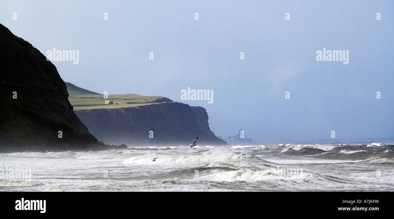 Boulby Cliffs from Staithes with a rough sea running North Yorkshire ...