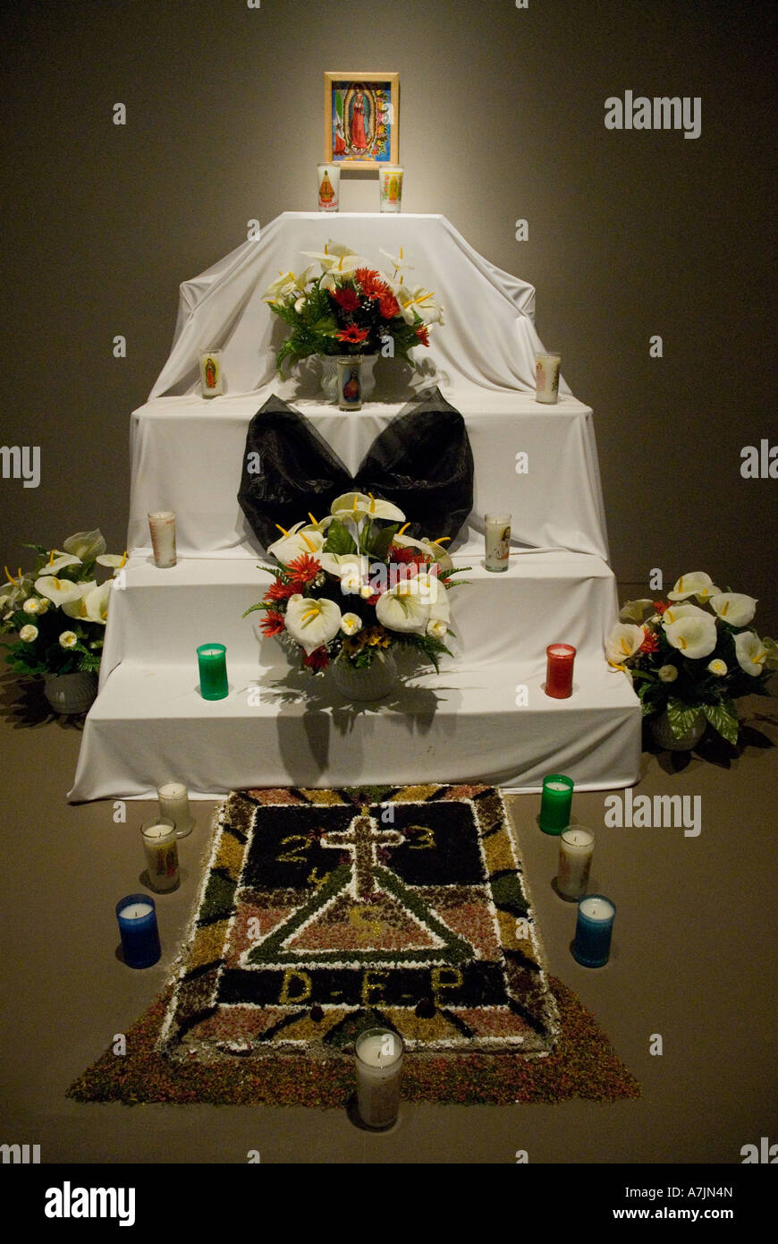 Little altar with flower and candles Stock Photo - Alamy