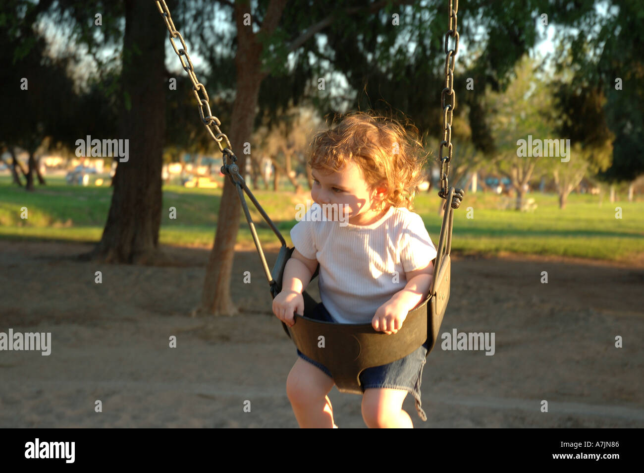 Child swing suspended hi-res stock photography and images - Alamy