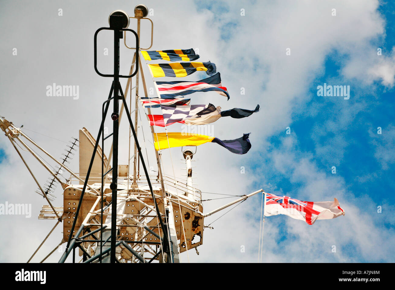 HMS Belfast in London flying the ensign and other flags from her ...
