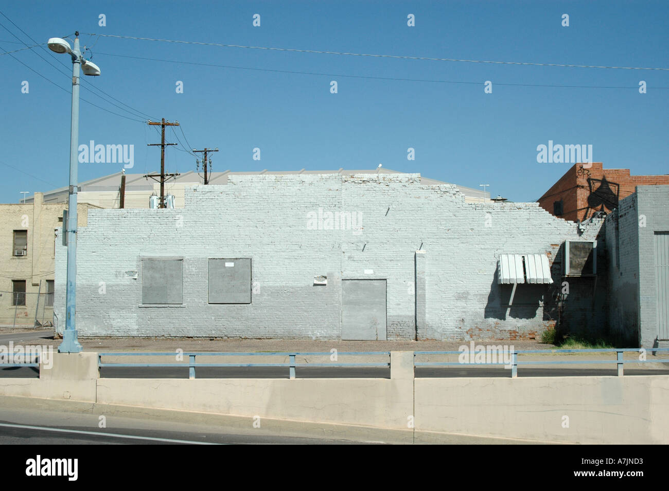 Blue painted brick building in downtown Stock Photo - Alamy
