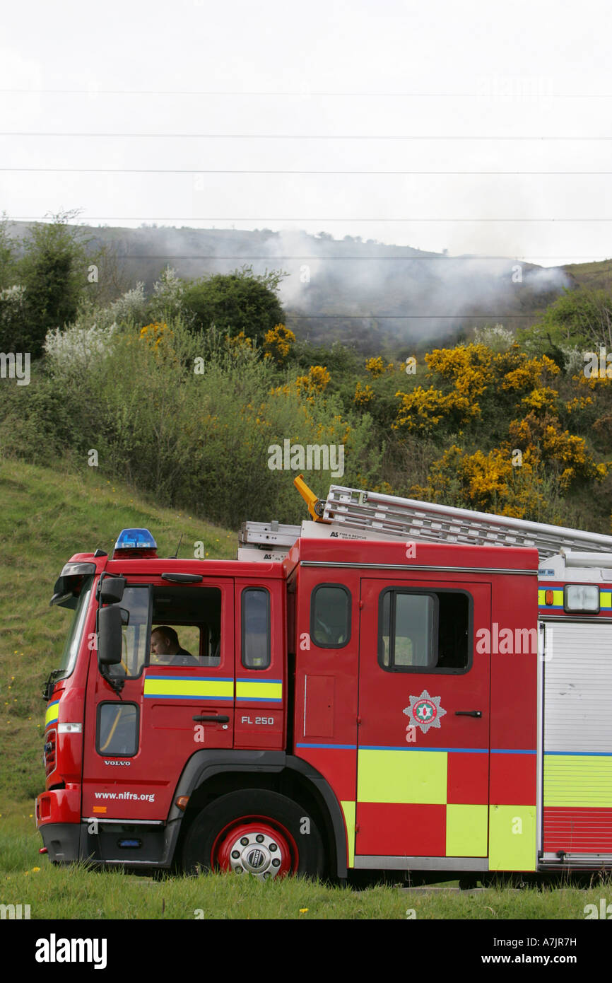 Fire Engine parked by the side of the road whilst fire crew attend ...