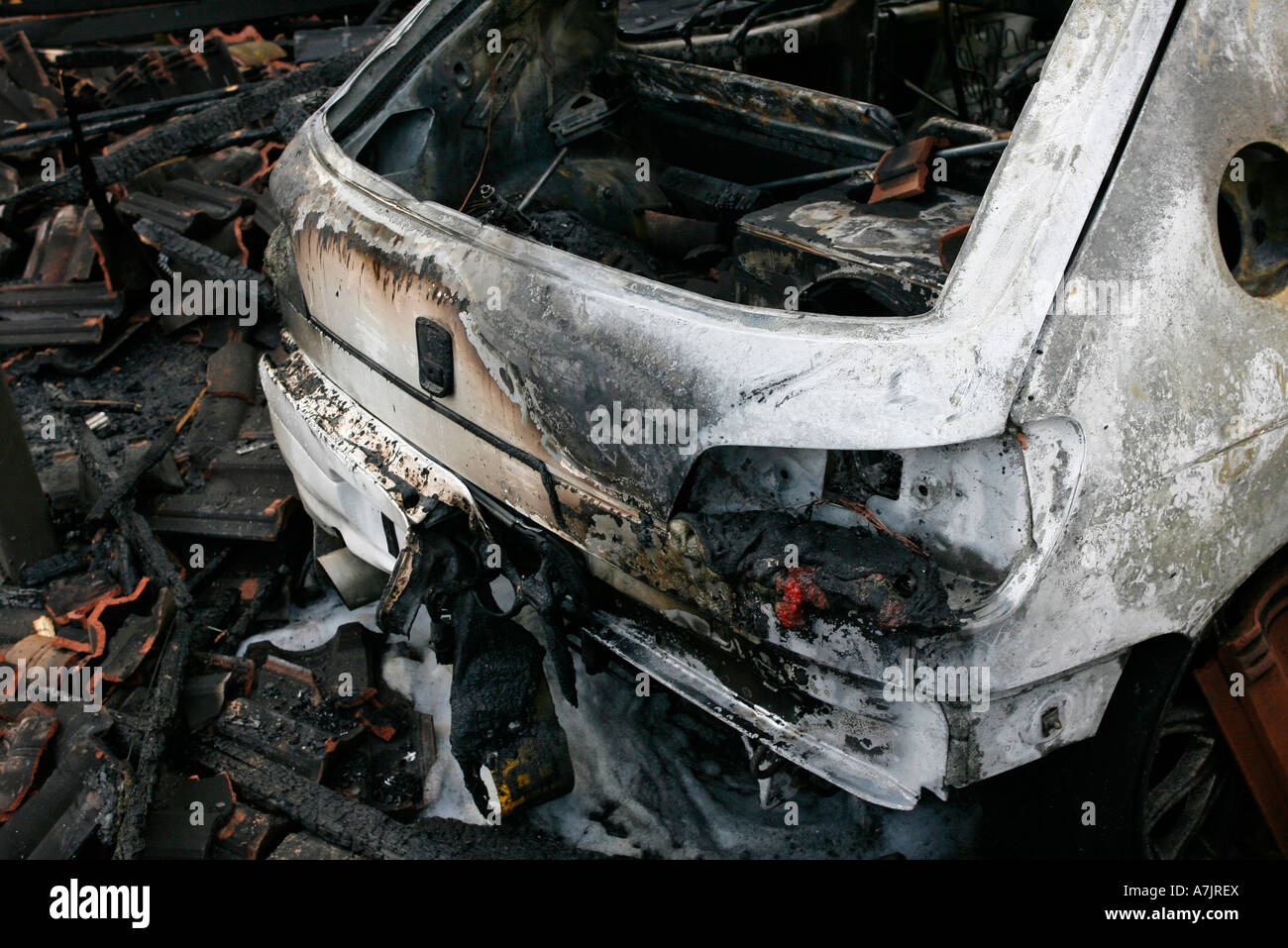 Rear bumper of a burnt out car Stock Photo - Alamy