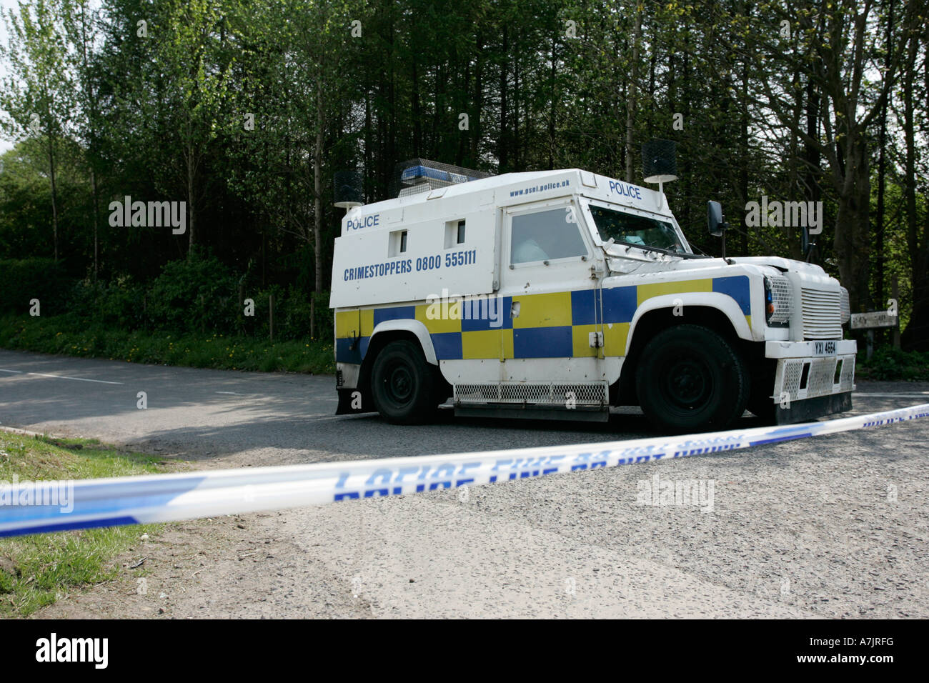 PSNI Land Rover behind police line tape at incident outside Belfast ...