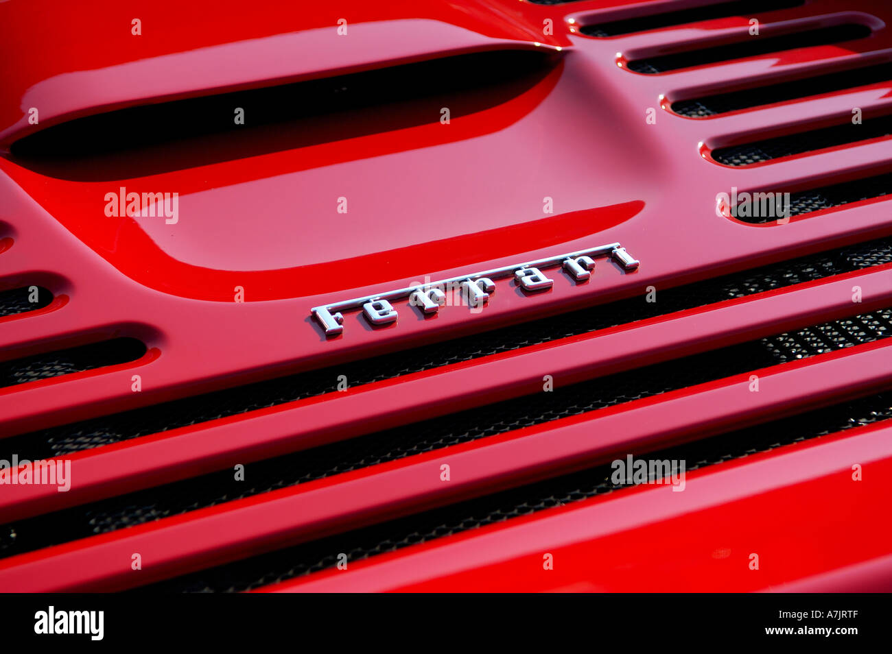 Logo on the engine hood of a red Ferrari sportscar Stock Photo - Alamy