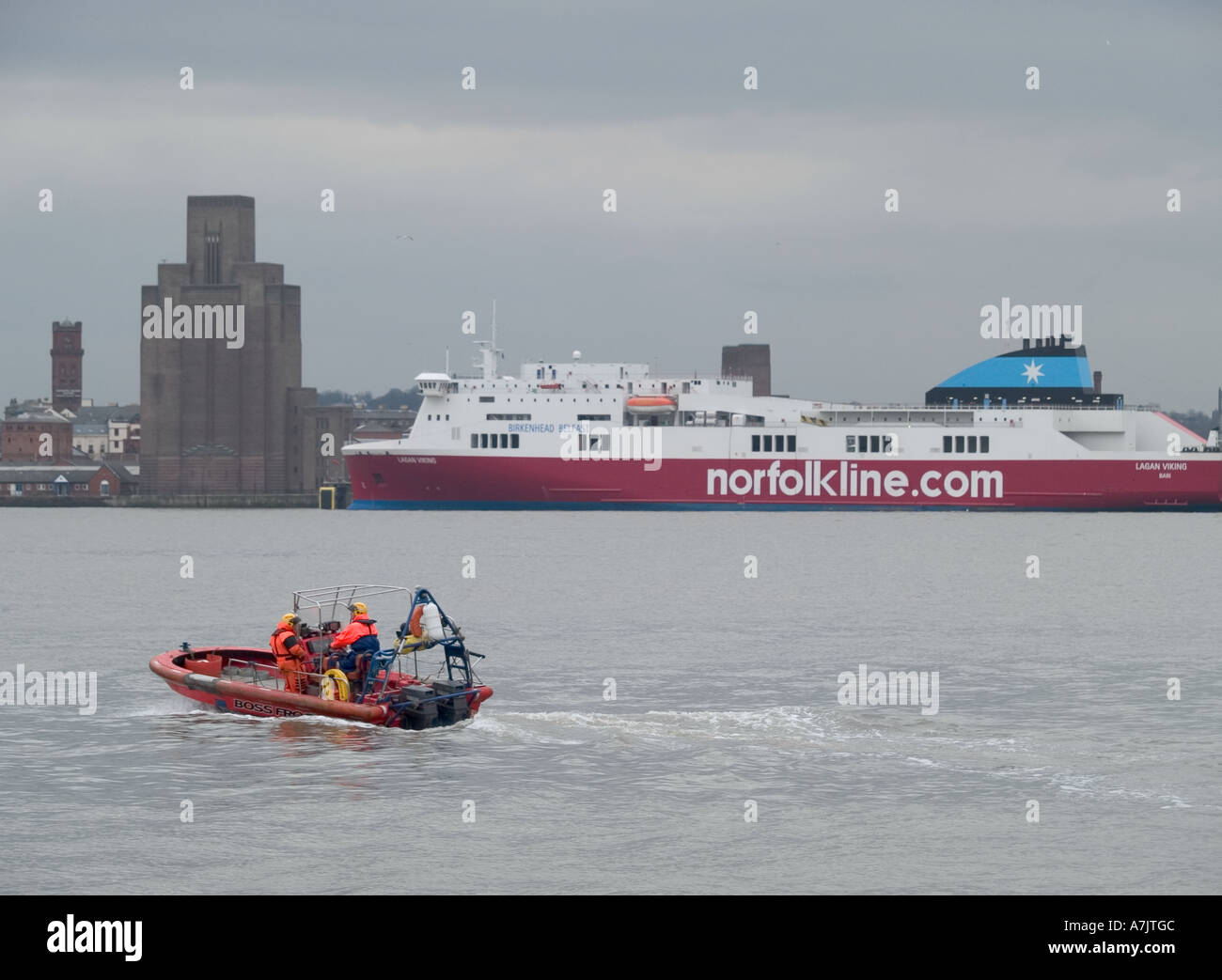 SMALL BOAT AND NORFOLK LINE SHIP ON THE RIVER MERSEY, LIVERPOOL ...