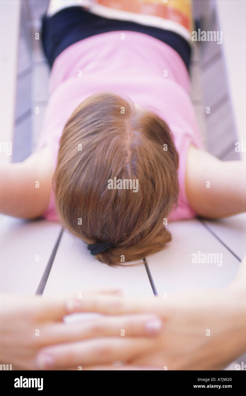 High angle view of a woman lying on a chair Stock Photo - Alamy