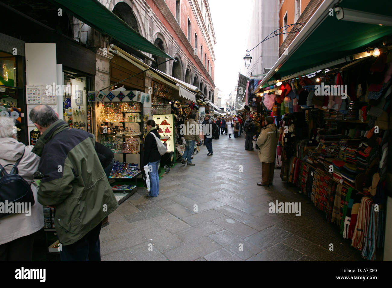Tourists explore the ancient market stalls and shops in the Fabbriche ...