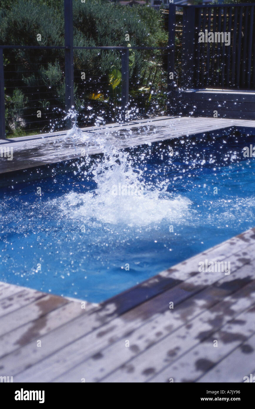 View of a splash in a swimming pool Stock Photo - Alamy