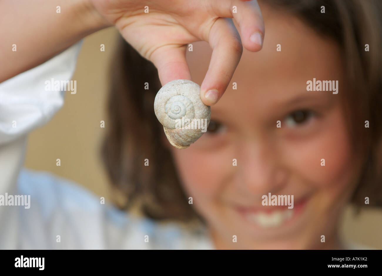 girl with snail shell Stock Photo - Alamy