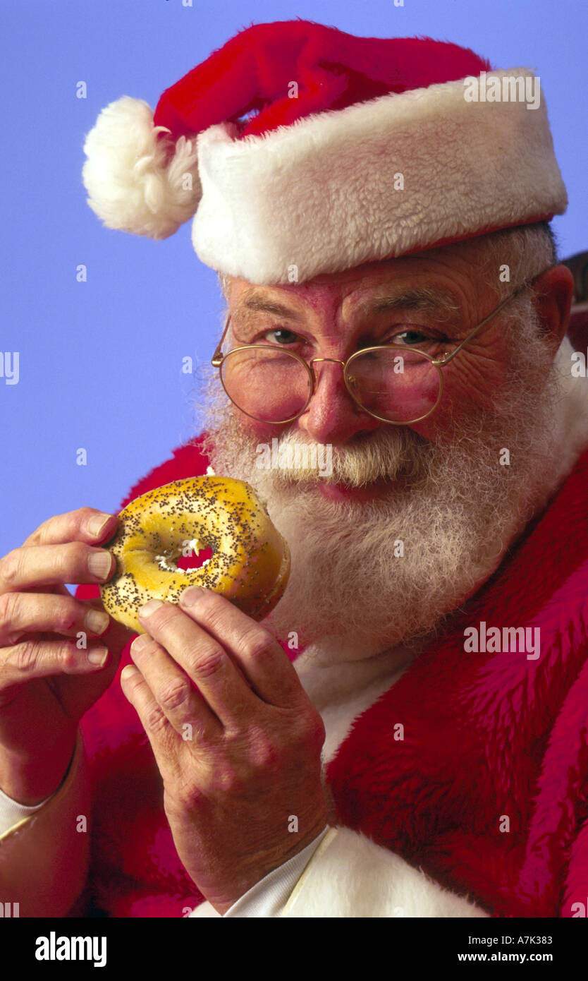 Santa Claus eating a bagel Stock Photo - Alamy