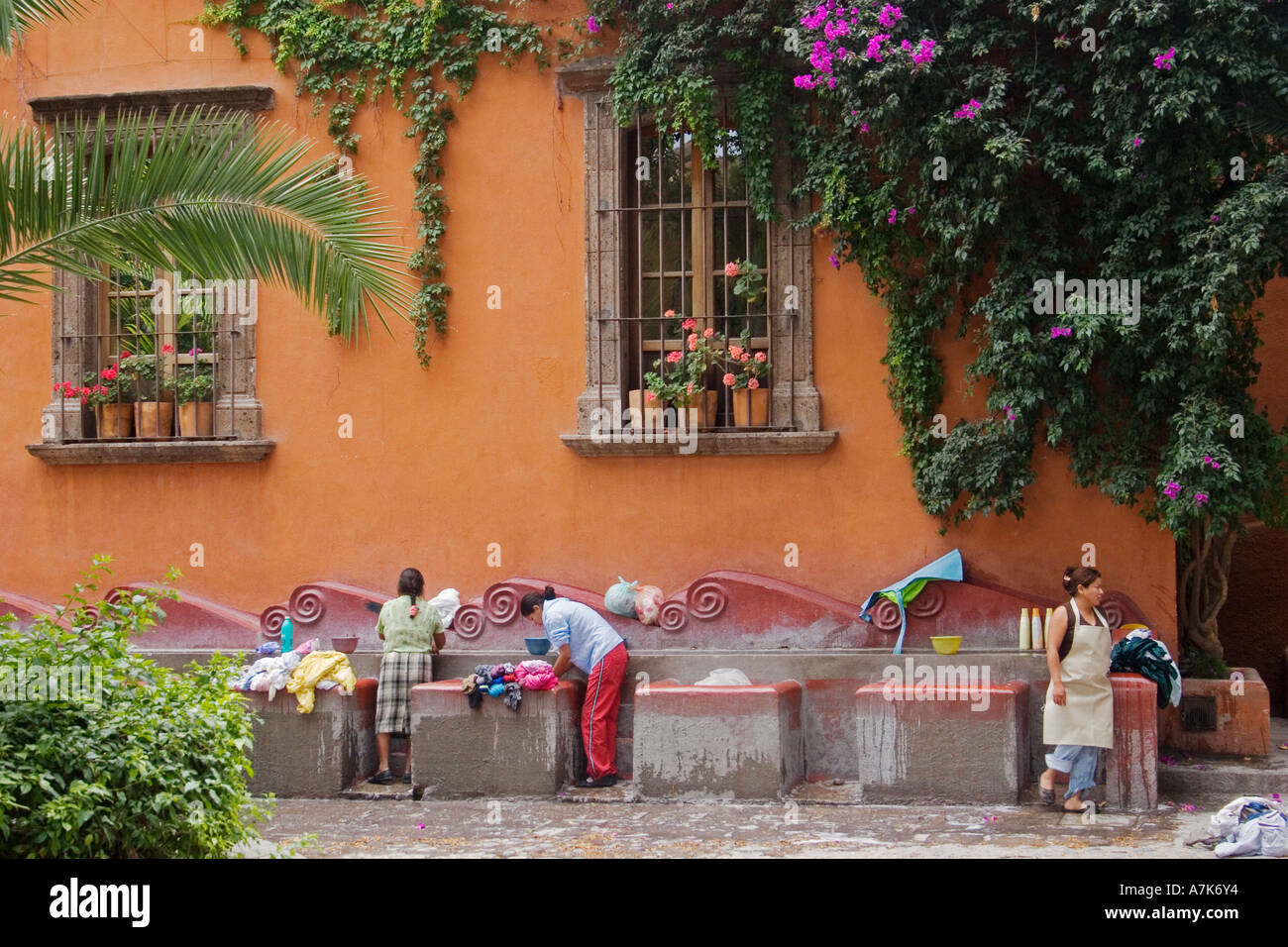 Mexican women still use the historic outdoor washing area to do their ...