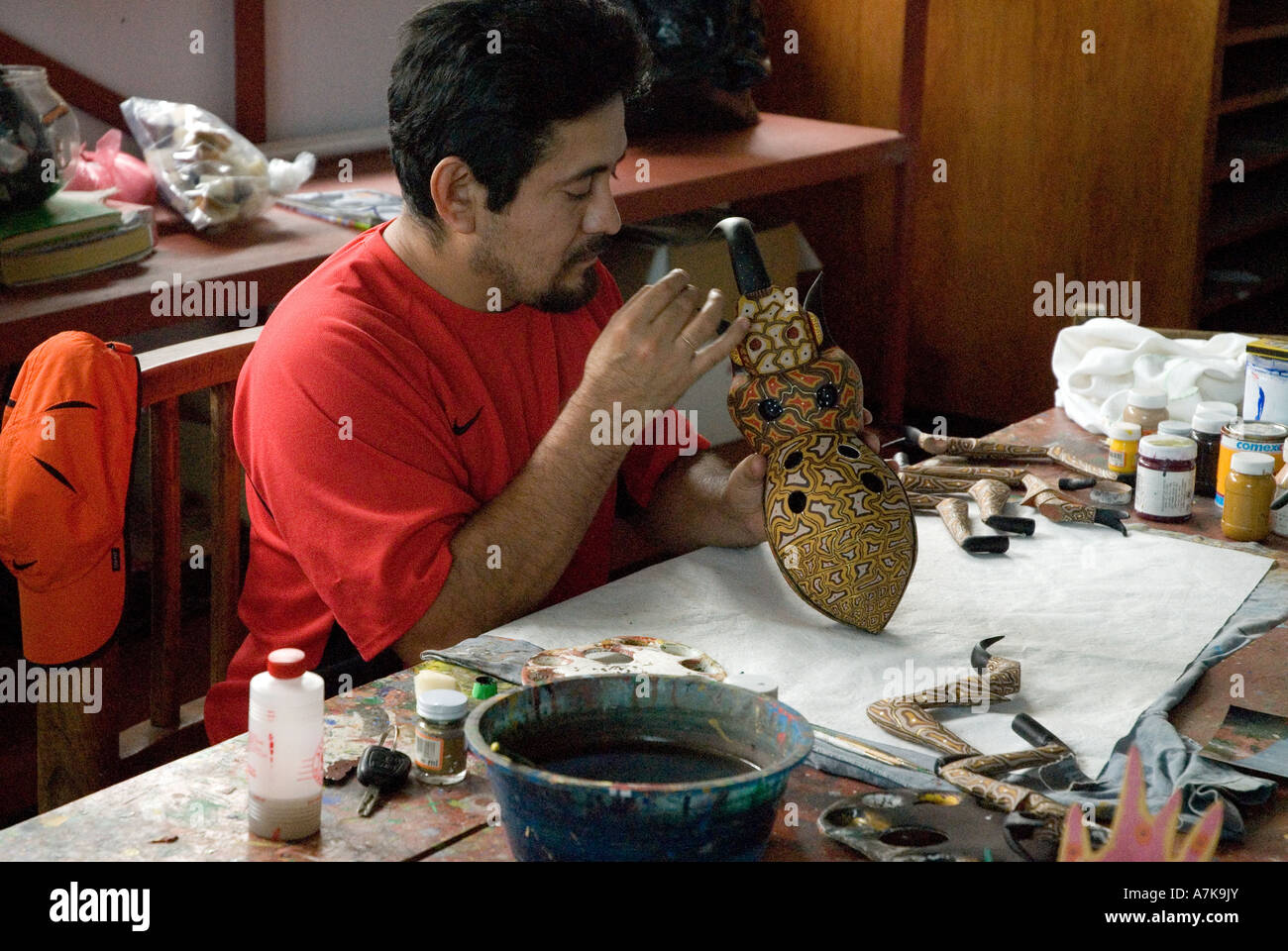 man painting Animals made with copal wood in Arazola - Oaxaca - Mexico ...