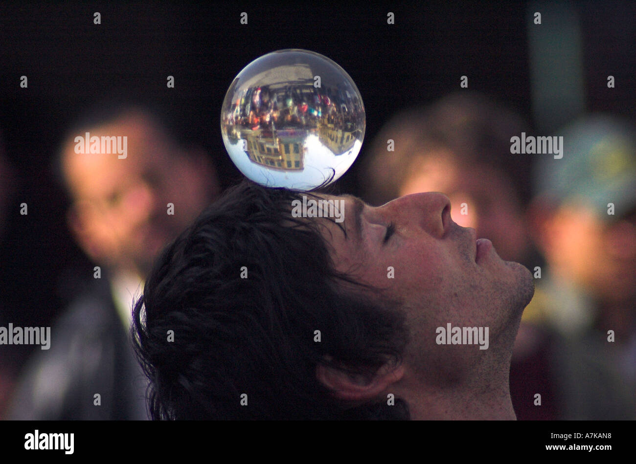Street Juggler Contact Juggling with a crystal ball Stock Photo - Alamy
