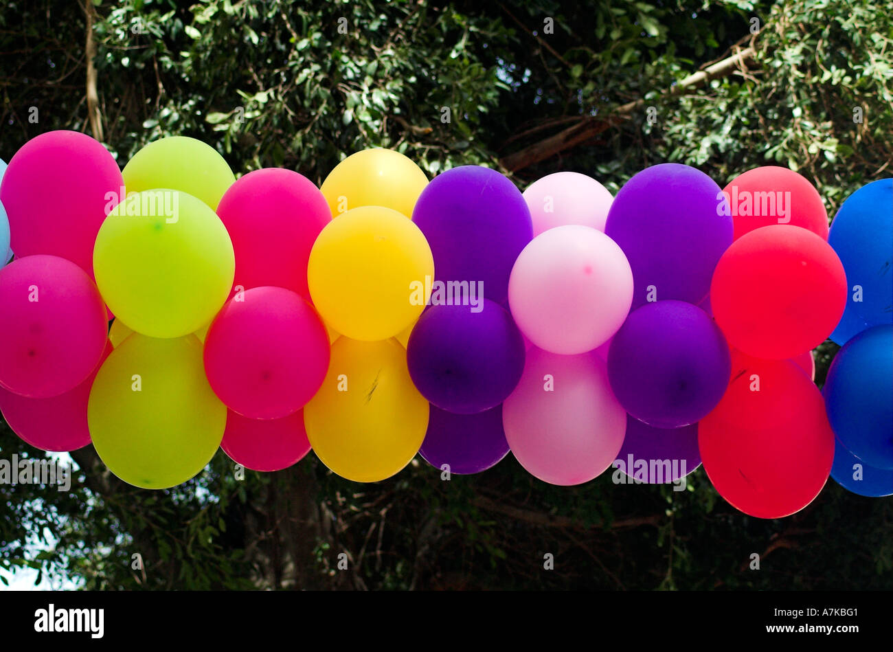colourful balloons hanging outside Stock Photo - Alamy