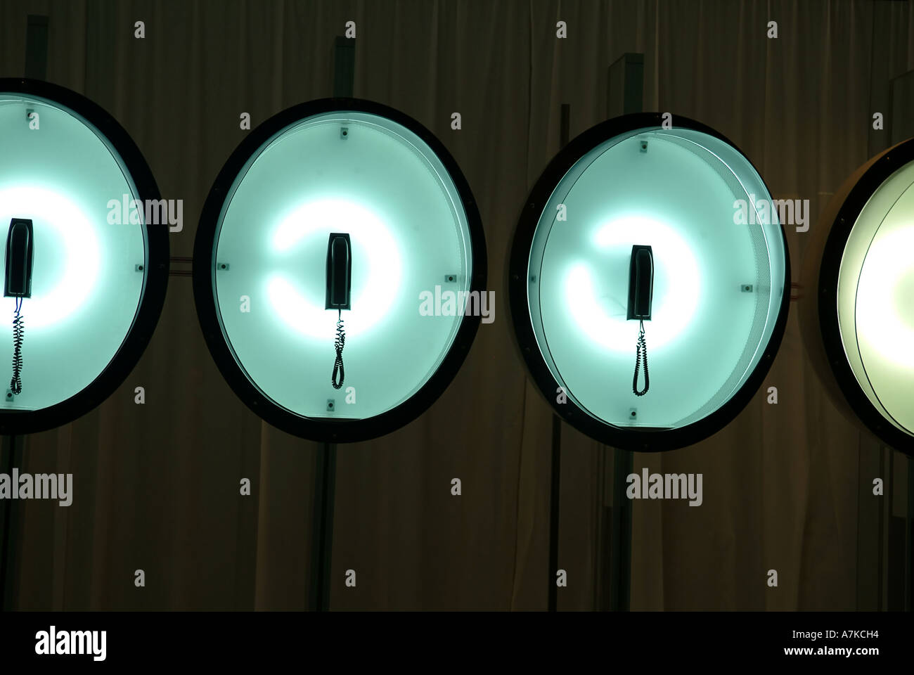 Phone booth with blue lights Stock Photo - Alamy