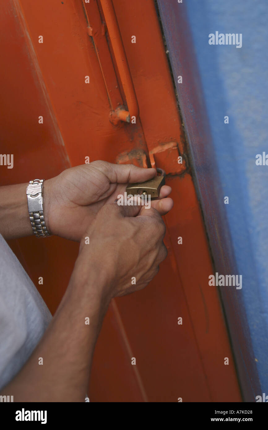 Man and hands locking door hi-res stock photography and images - Alamy