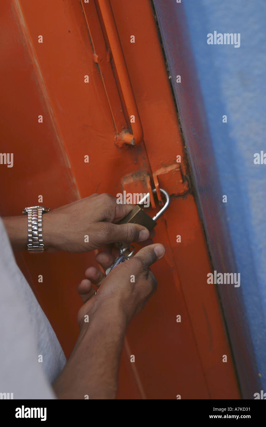 Man and hands locking door hi-res stock photography and images - Alamy