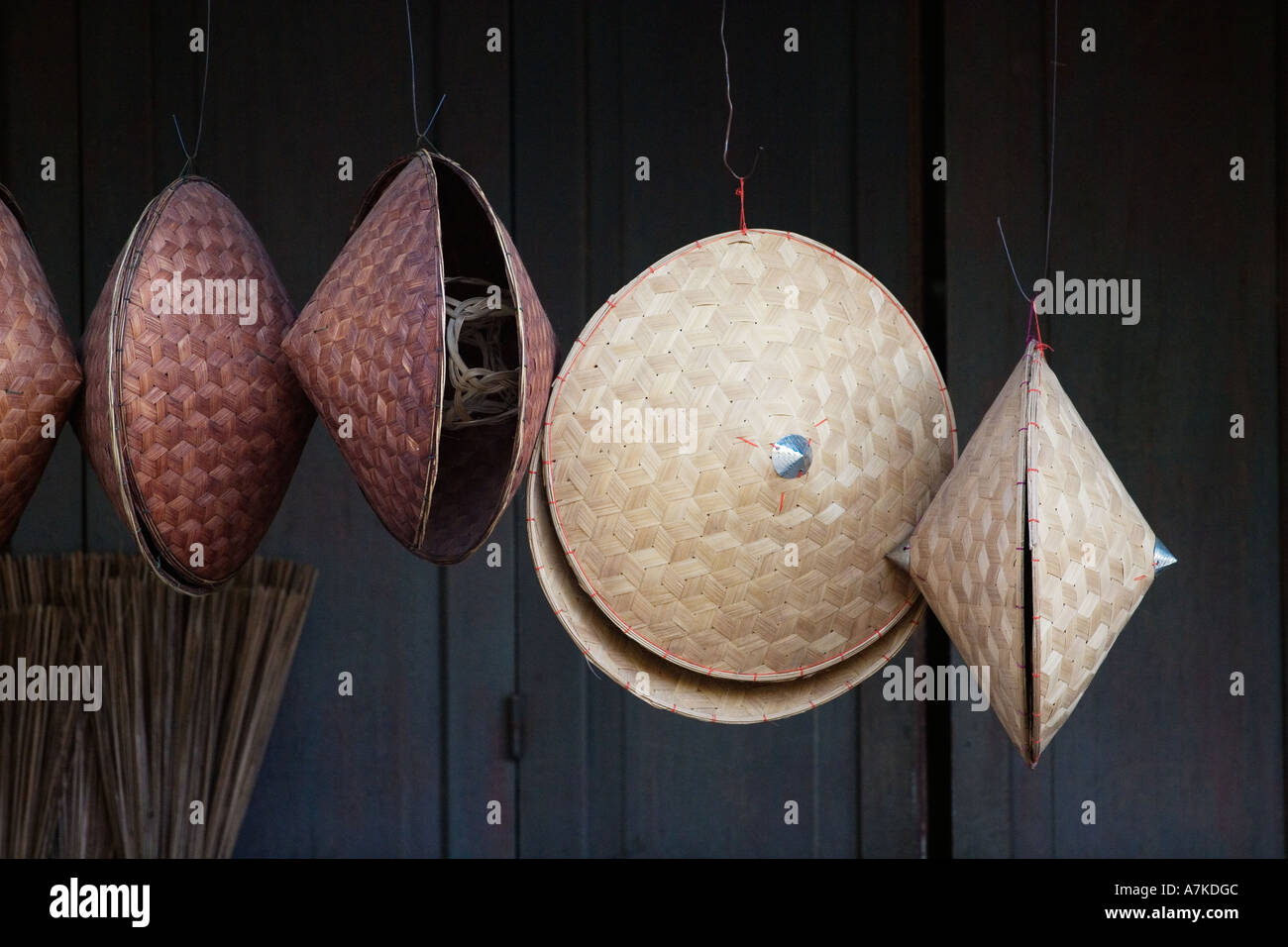 Hand woven rattan hats hang in a shop LUANG PROBANG LAOS Stock Photo ...