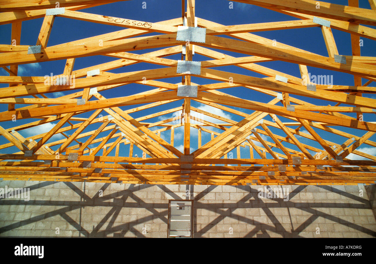 Roof trusses on house under construction Stock Photo - Alamy