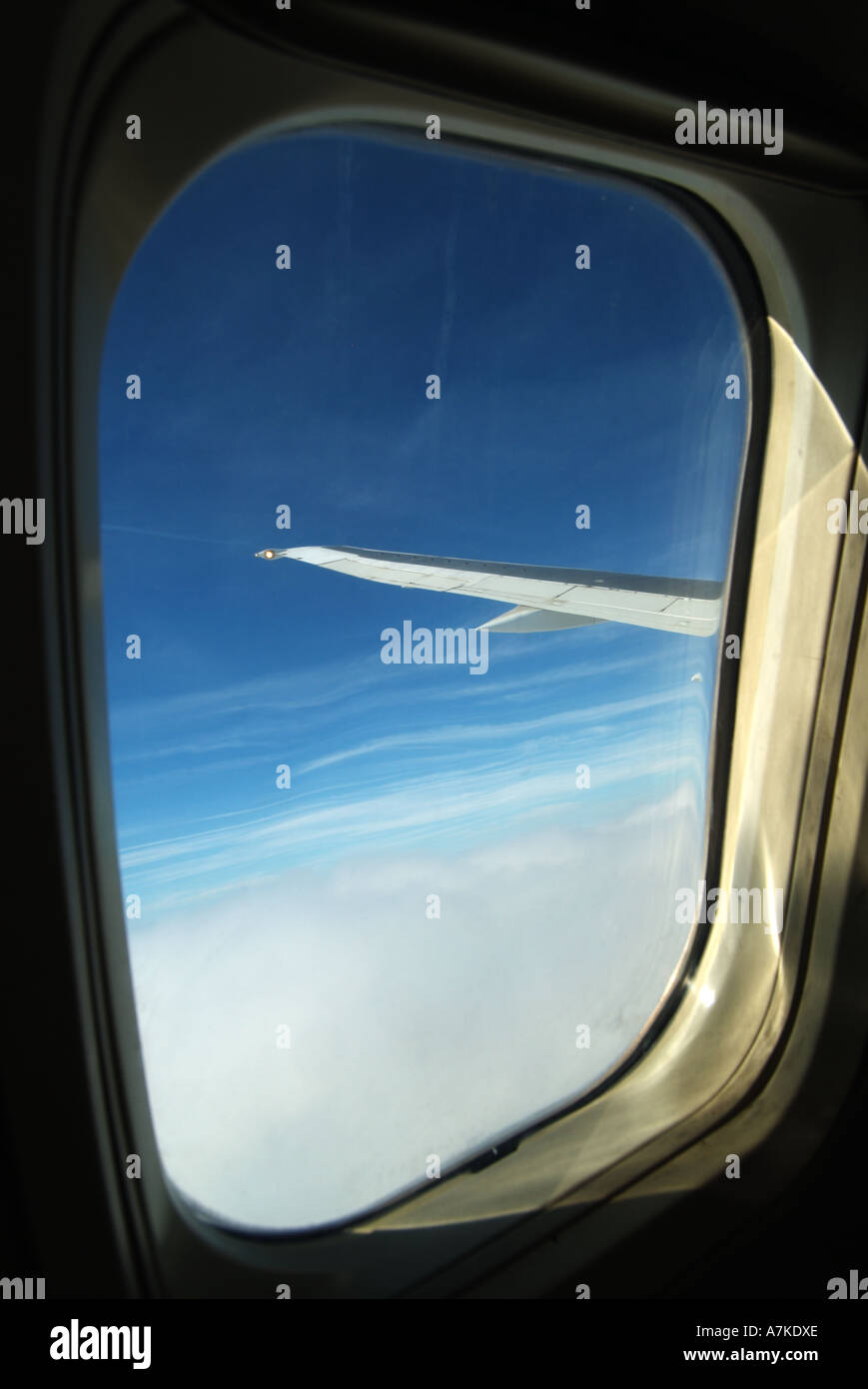 View out of passenger jet aircraft window flying above dense cloud ...