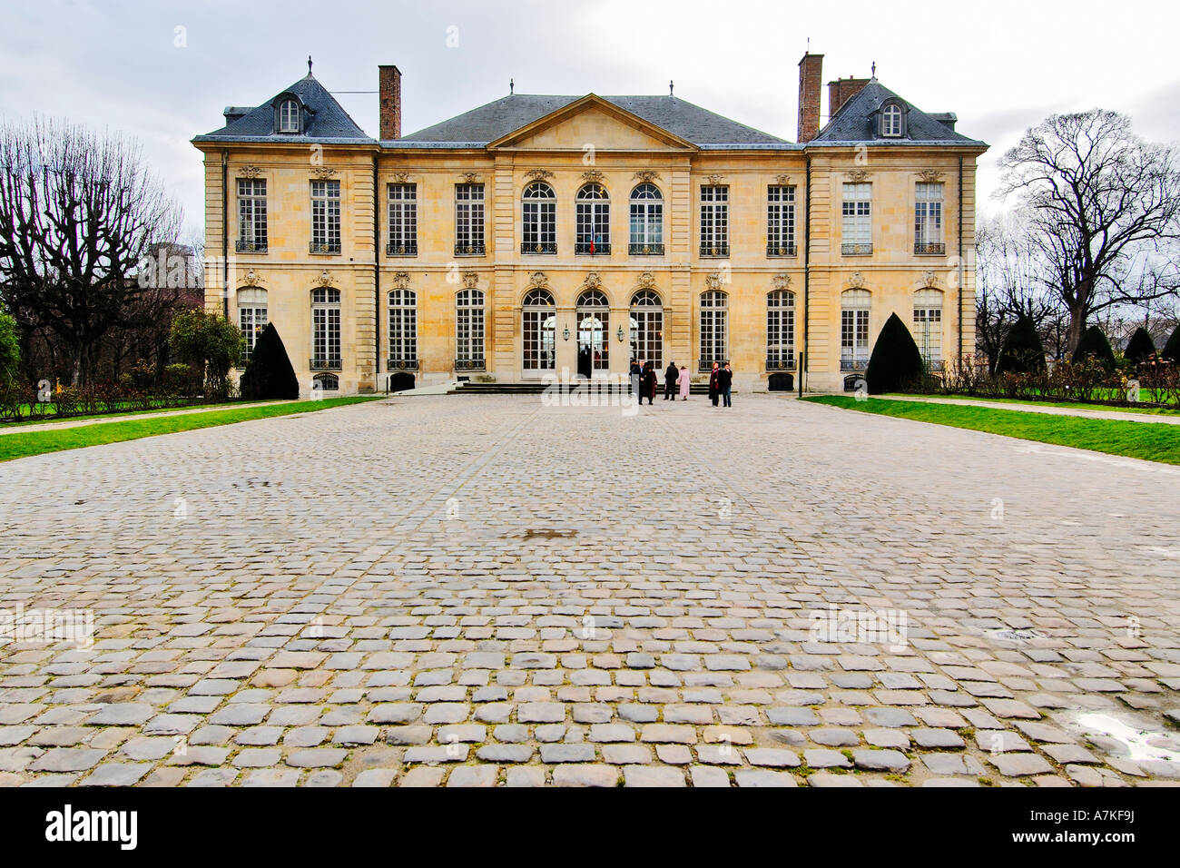 Outside view of the Rodin Museum in Paris, France with cobblestone path ...