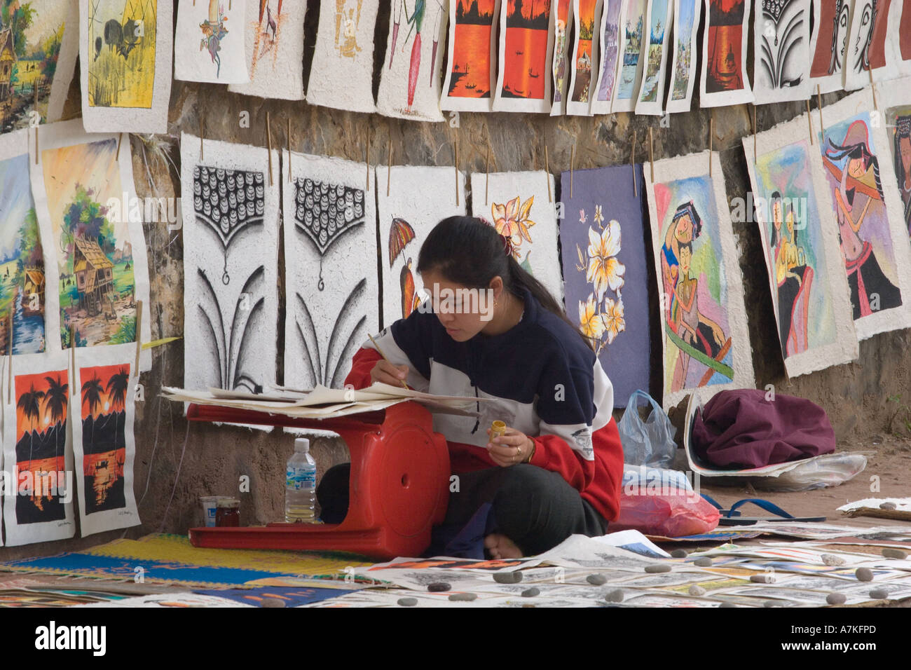 A painter sells her paintings of local scenes are offered for sale in ...