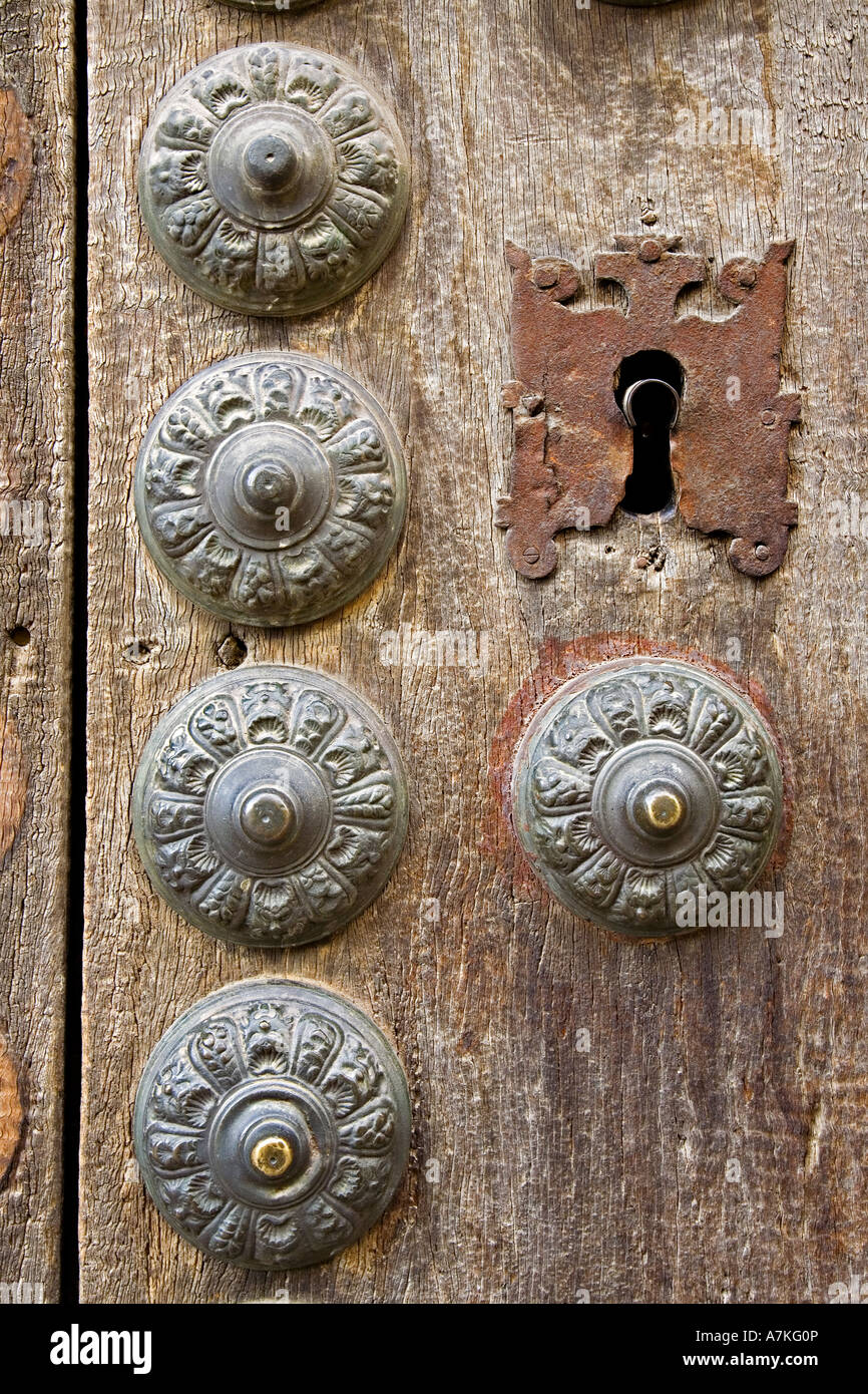 Decorated metal studs and old rusty keyhole in wooden door Granada ...