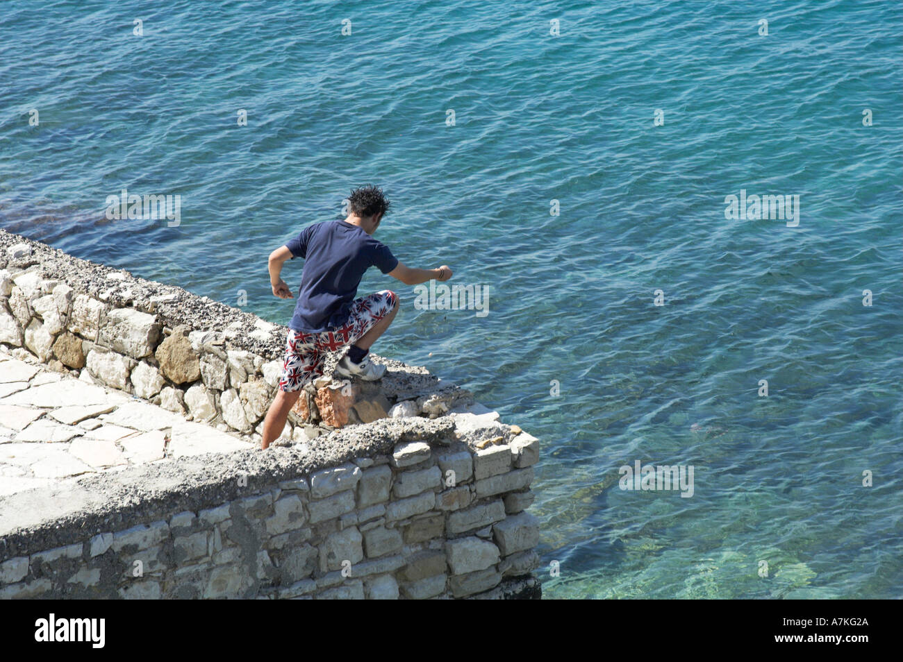 Corfu Fishing in the crystal clear sea at Corfu Old Town Stock Photo ...