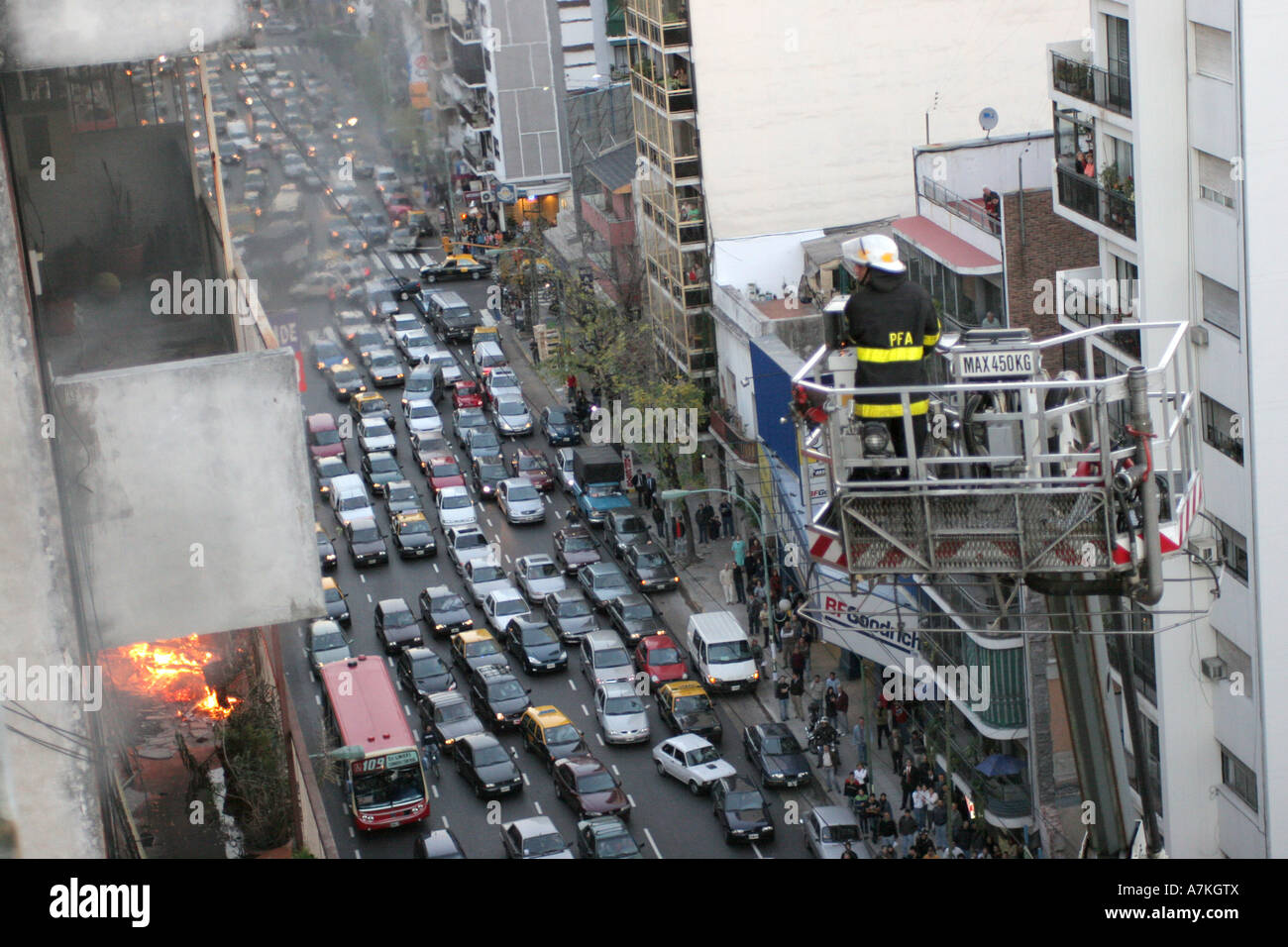 Firefighter rescuing people from a building with a crane Stock Photo ...