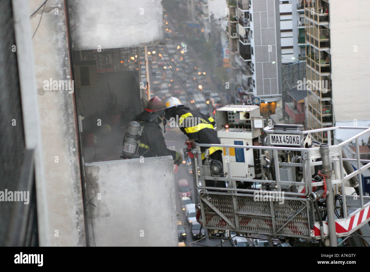 Firefighter rescuing people from a building with a crane Stock Photo ...