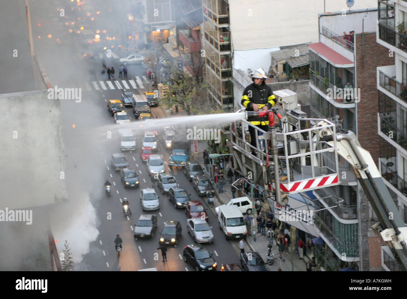 Firefighter rescuing people from a building with a crane Stock Photo ...
