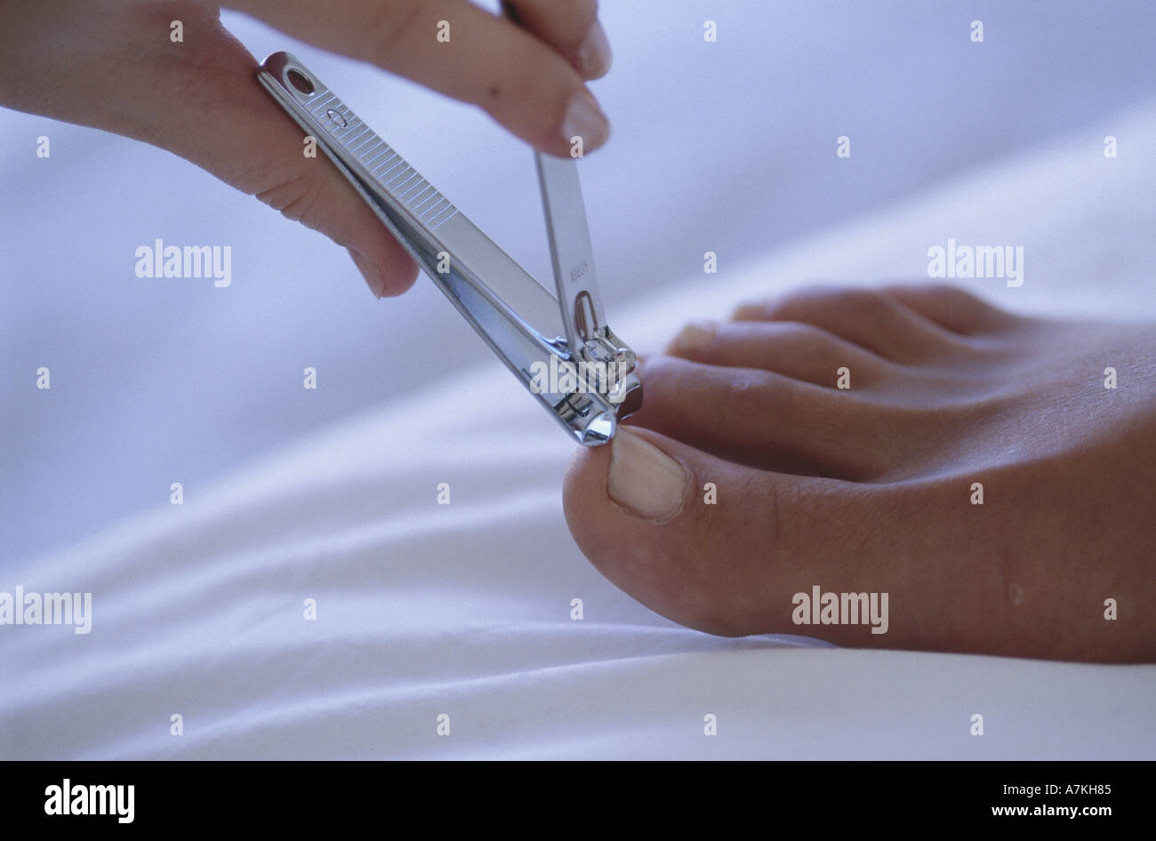 Cutting toe nails hi-res stock photography and images - Alamy