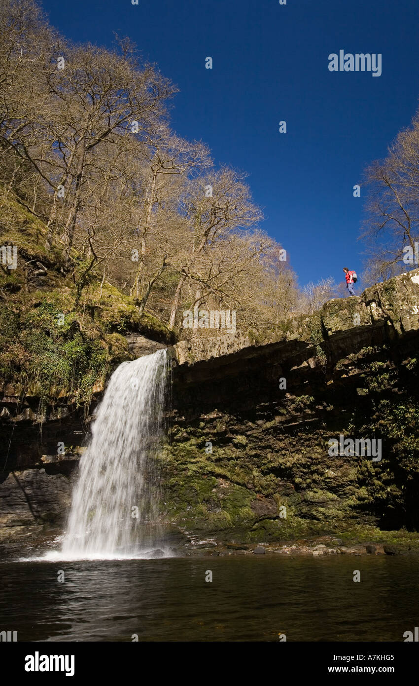 Female walker at Sgwd Gwladys Lady Waterfall Brecon beacons national ...
