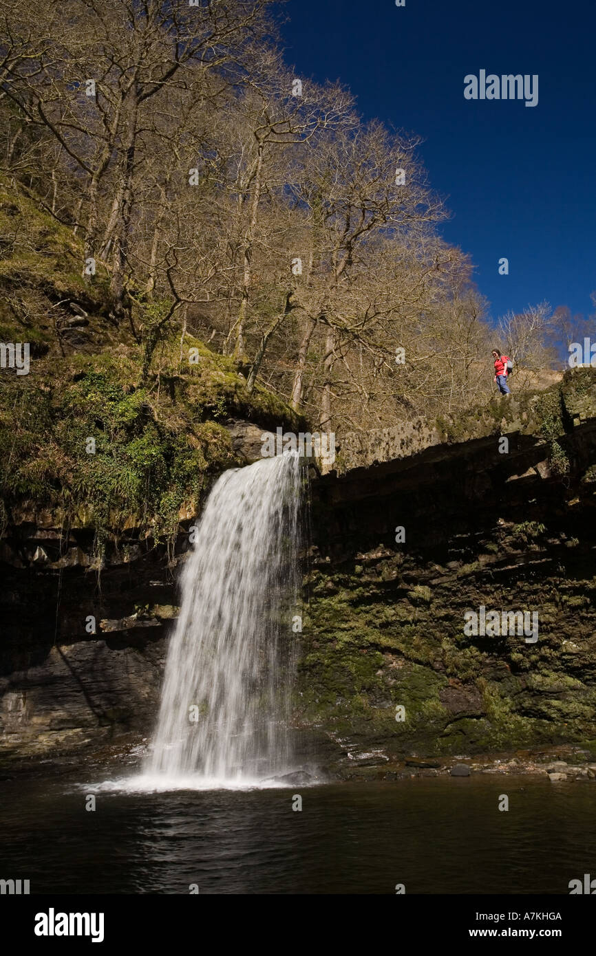 Female walker at Sgwd Gwladys Lady Waterfall Brecon beacons national ...