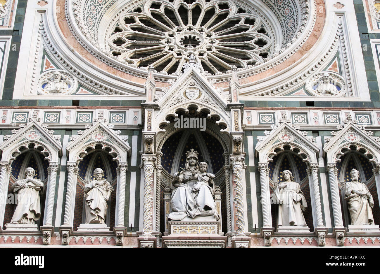 Marble carvings and ornate round windows and colourful tiles features ...