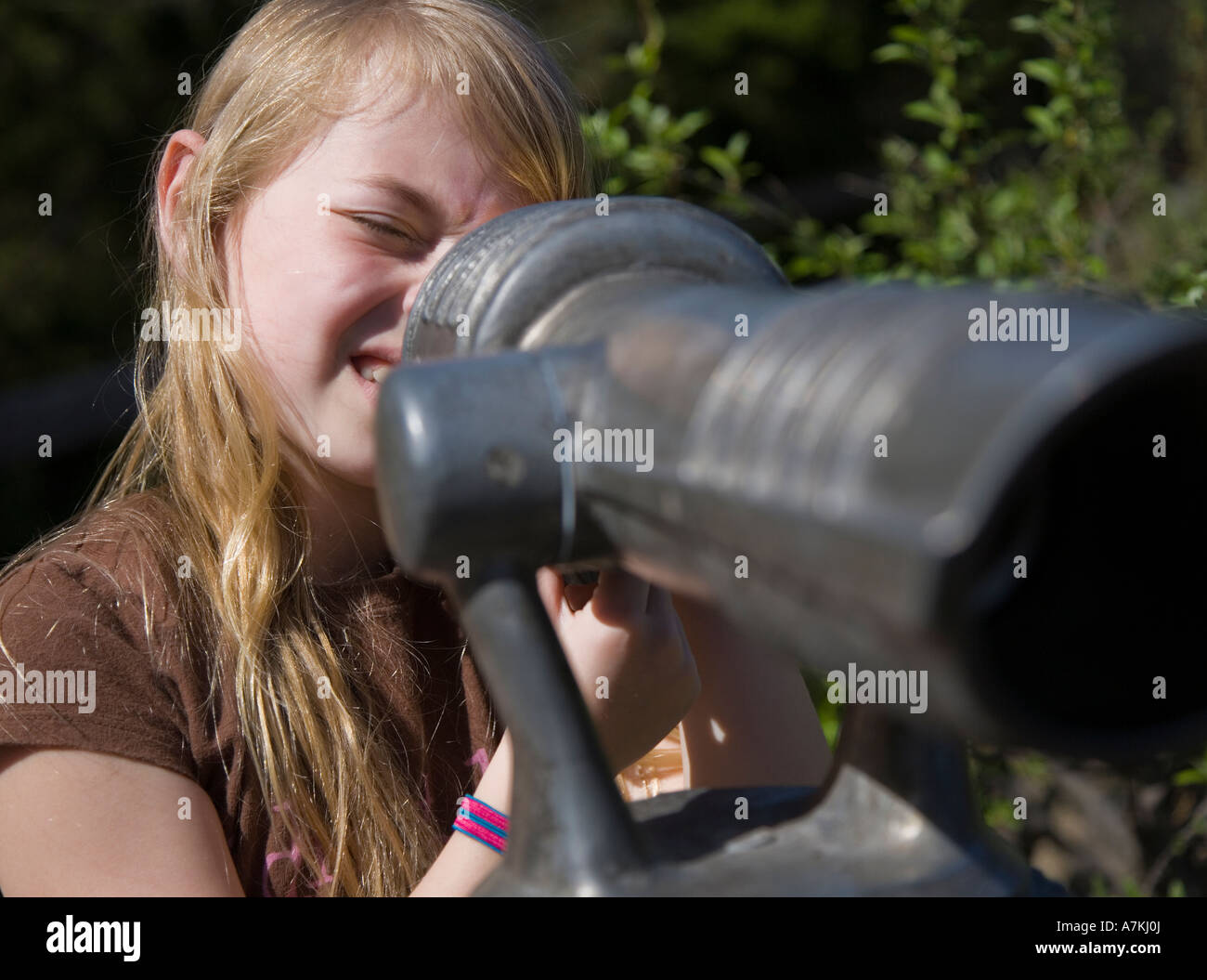 Child looking through a telescope Stock Photo - Alamy