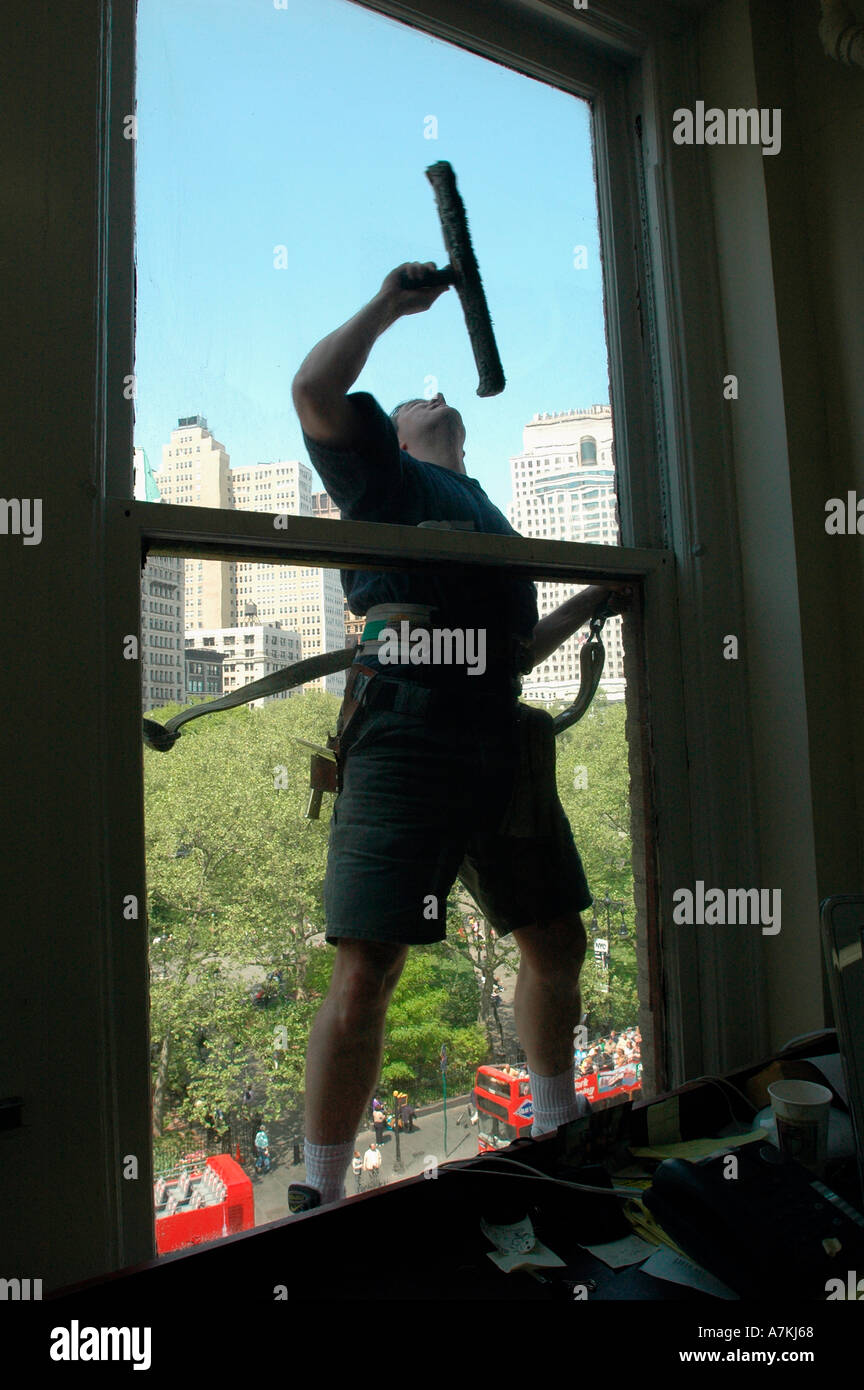 Window washer using his safety harness Stock Photo - Alamy