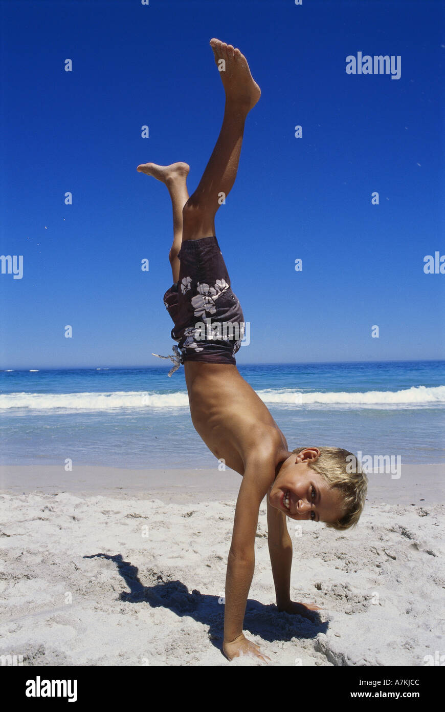 Boy doing a handstand hi-res stock photography and images - Alamy