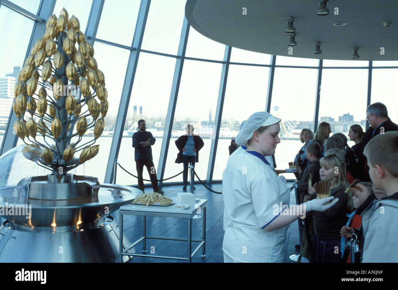 Children getting chocolate from a fountain of chocolate at the Imhoff ...